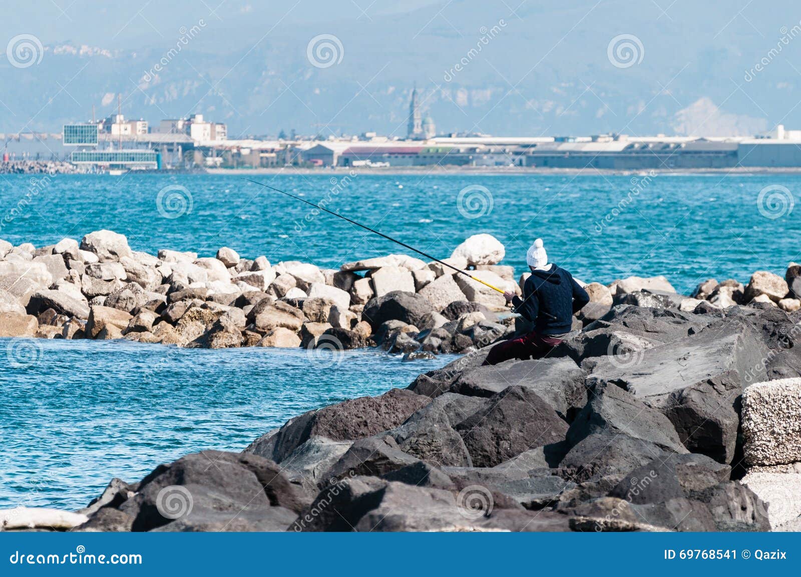 Fisherman on rocks editorial photo. Image of hobby, water - 69768541