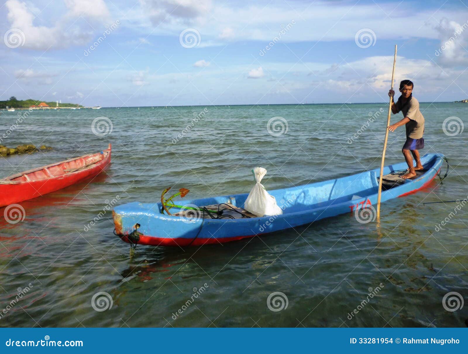 A Fisherman Rowing His Narrow Fishing Boat In The Ganges River ...