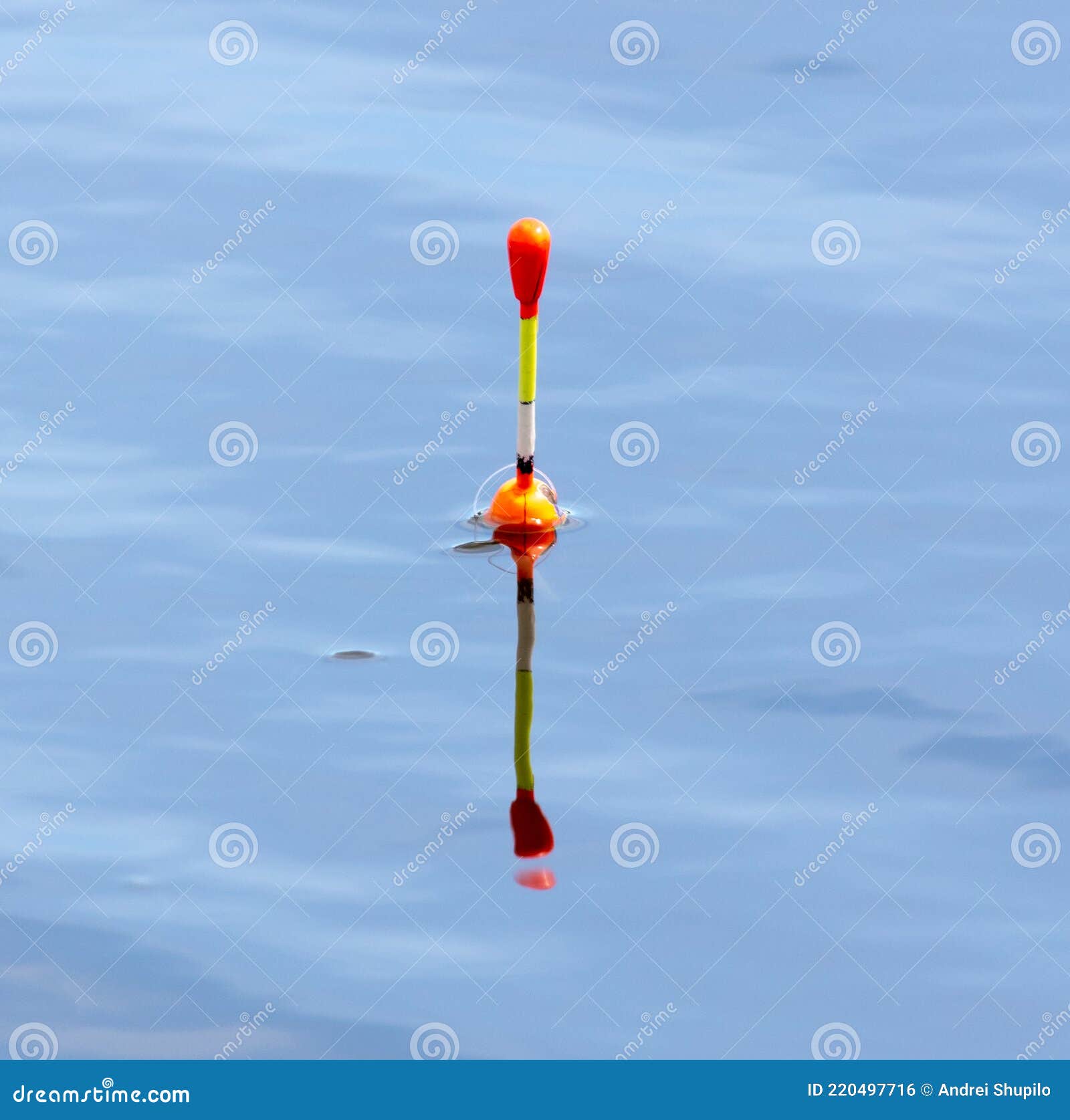 Fisherman S Float on the Blue Surface of the Water. Stock Photo - Image ...