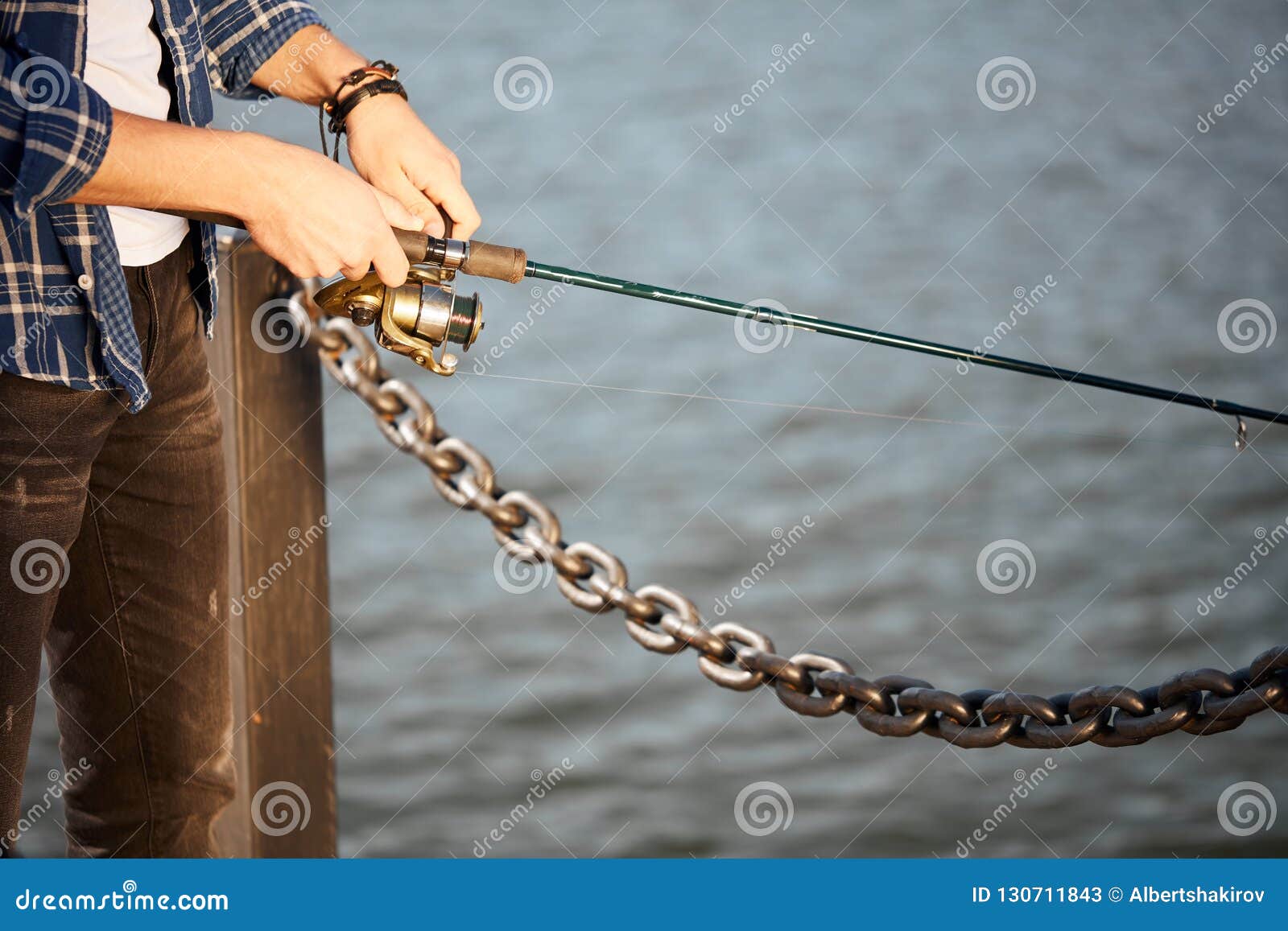 Fisherman Standing on Riverside and Trying To Catch Fish Stock Image ...