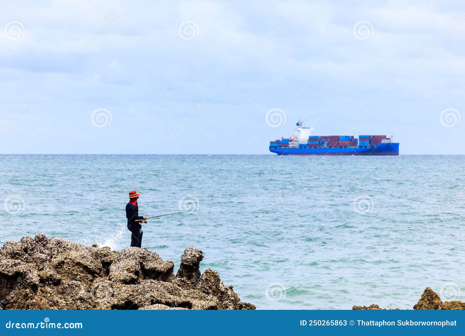 Fisherman Standing on the Rock and Container Ship Sailing in Sea ...