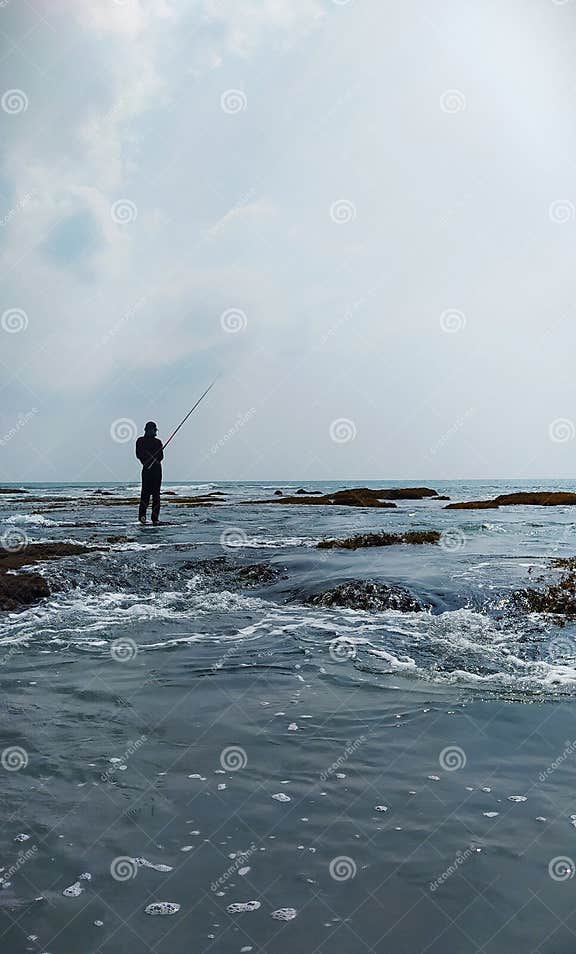 Fisherman Still Waiting for a Fish Stock Image - Image of still, beach ...
