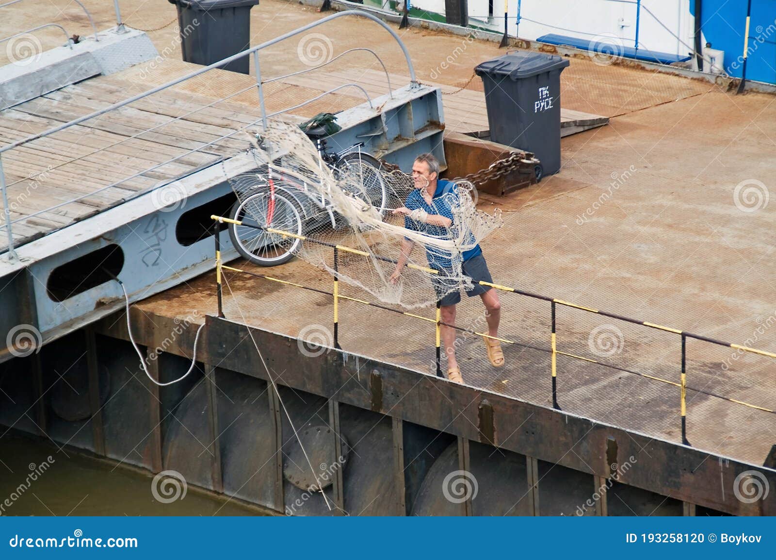 A fisherman throwing a net editorial image. Image of nature - 193258120