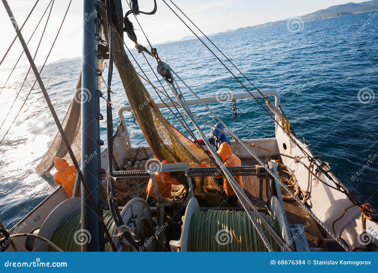 Fishermen pull trawl fish stock photo. Image of fisherman - 68676384