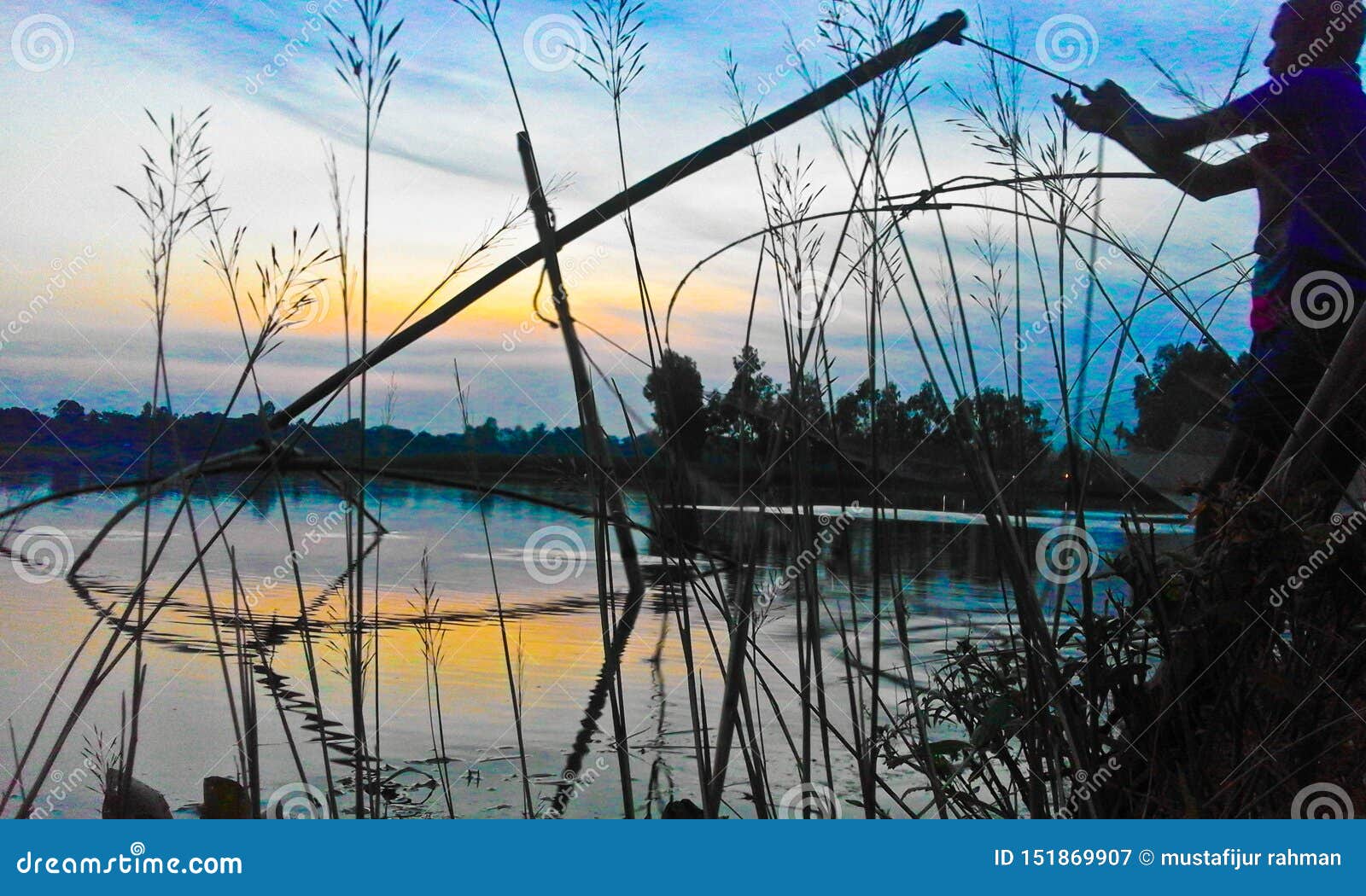 A Fishermen Waiting for the Hold Fish in the River Editorial ...