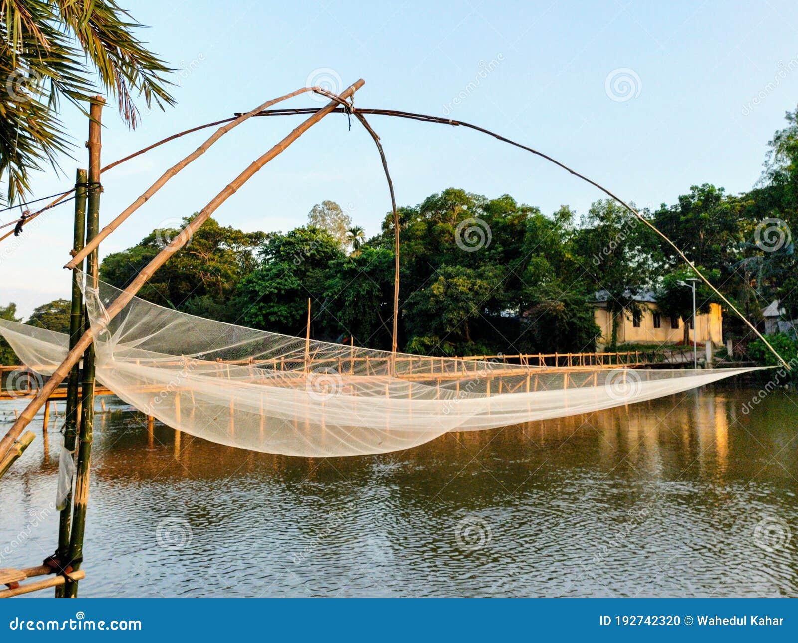 Fishing net in the river stock photo. Image of water - 192742320