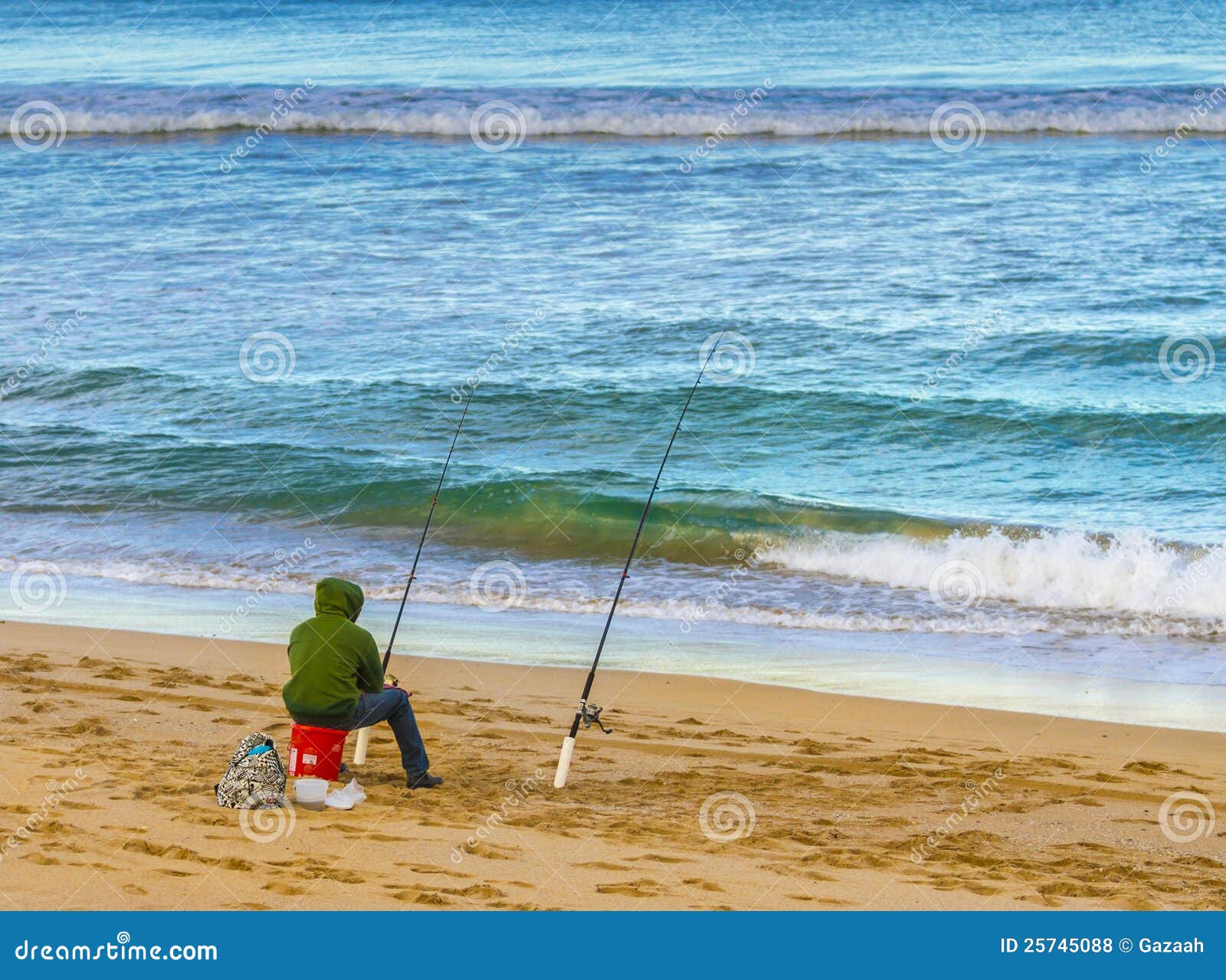 Fishing on a Beach stock photo. Image of jeans, retirement - 25745088