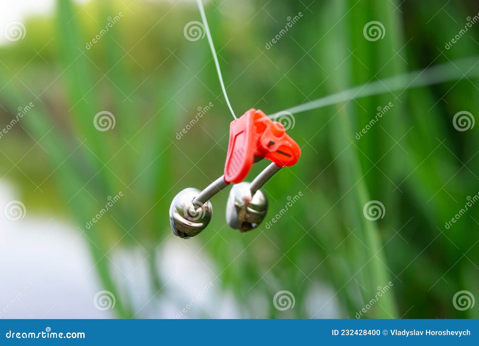 Fishing Bell Hanging on a Fishing Line Stock Photo - Image of isolated ...