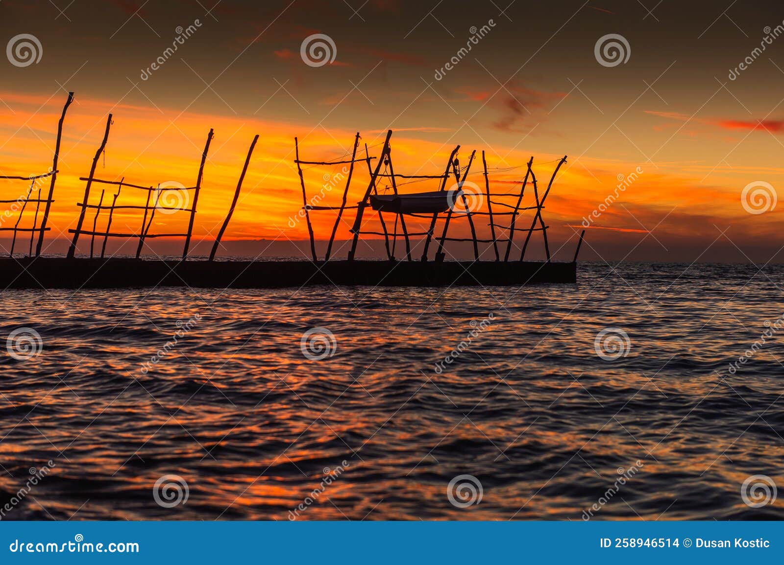 Fishing Boat on Dock and Sunset Stock Photo - Image of dawn, bridge ...