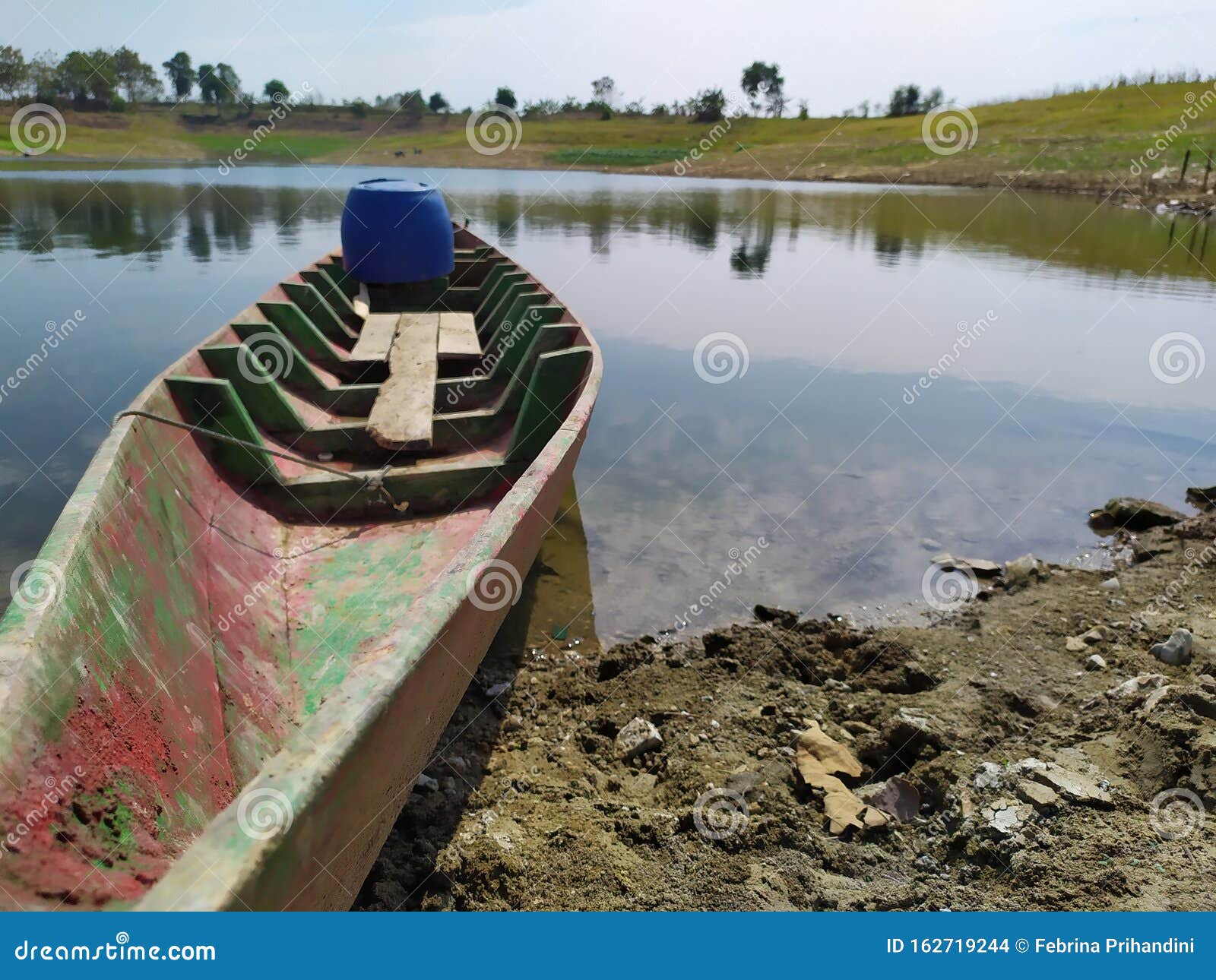 Fishing Boat on the Edge of the Lake with Blue Sky Stock Photo - Image ...
