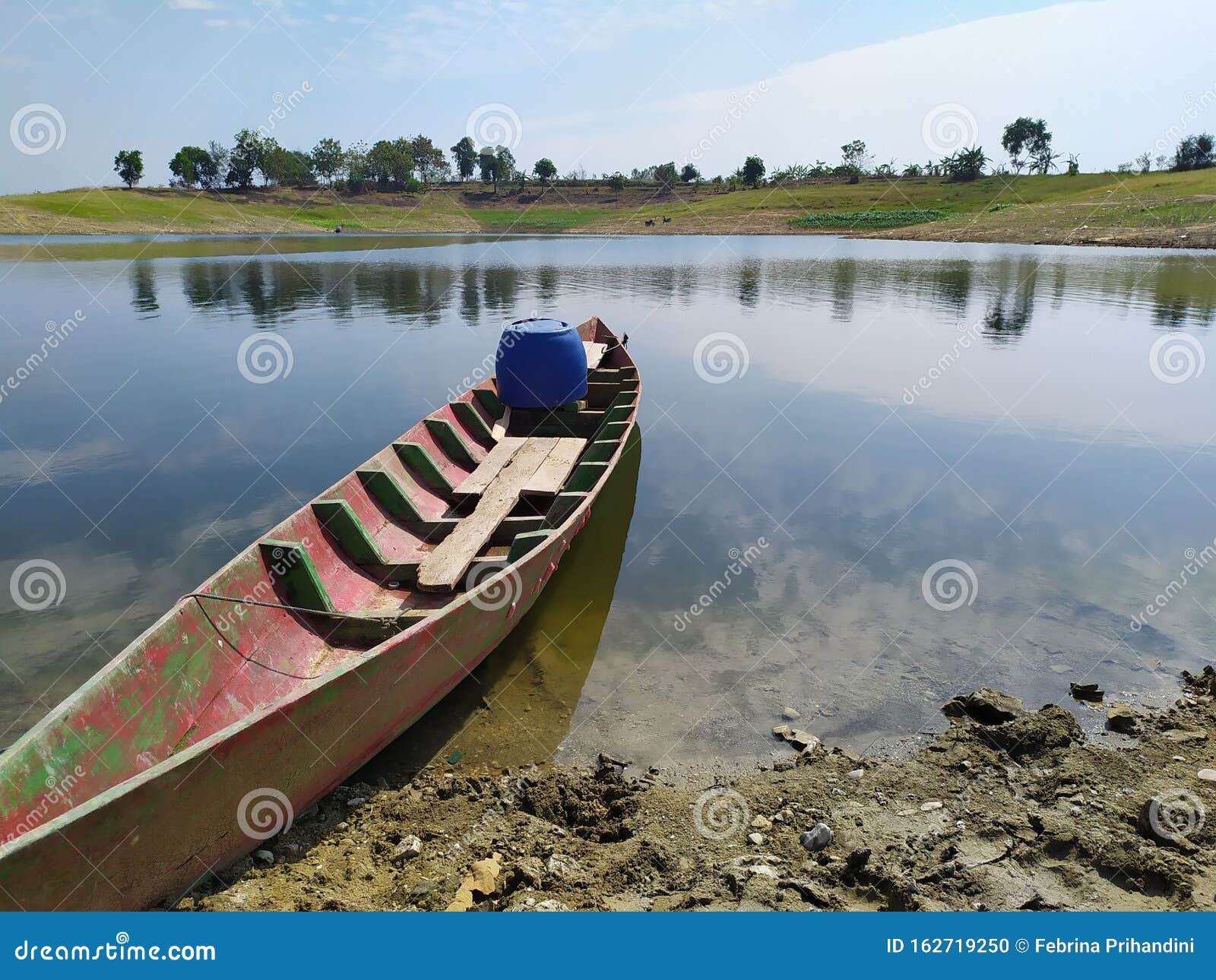 Fishing Boat on the Edge of the Lake with Blue Sky Stock Photo - Image ...