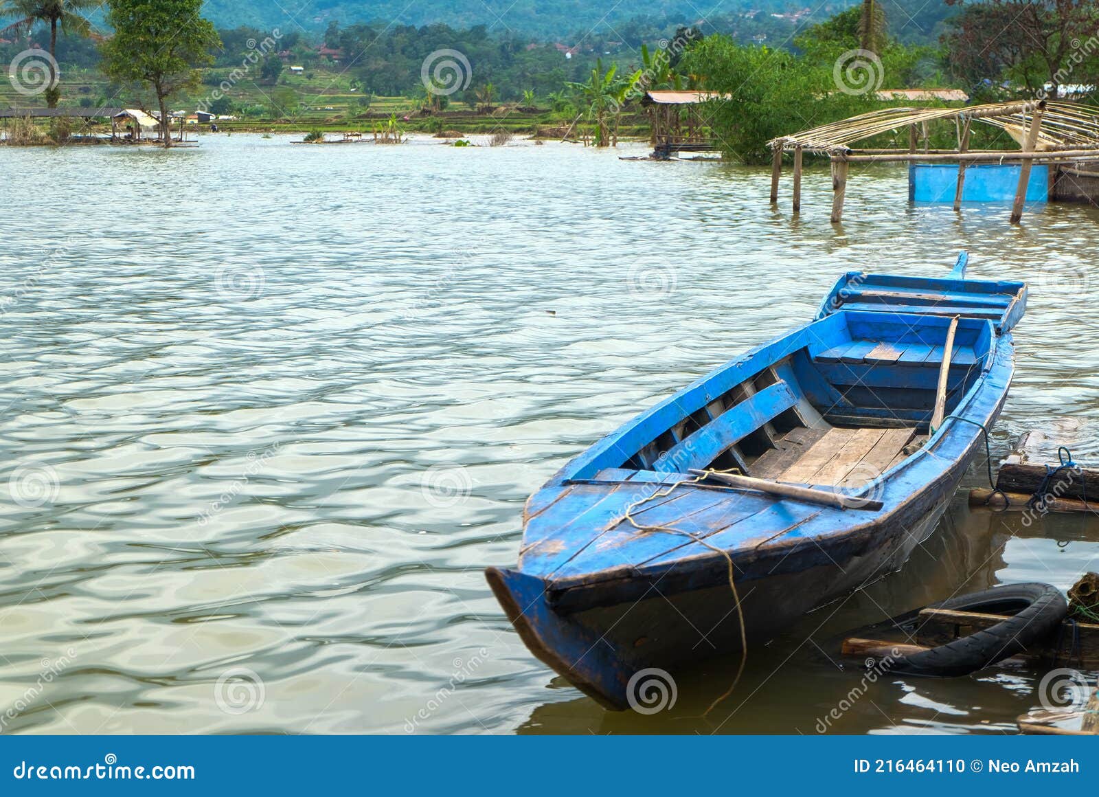 Fishing boat in the lake stock photo. Image of canoe - 216464110