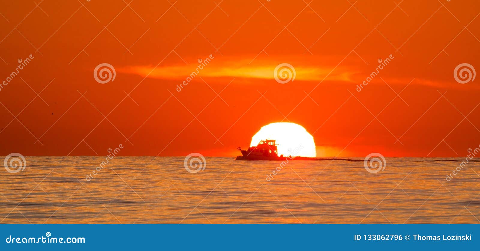 Boat sunrise stock photo. Image of atlantic, boat, passing - 133062796