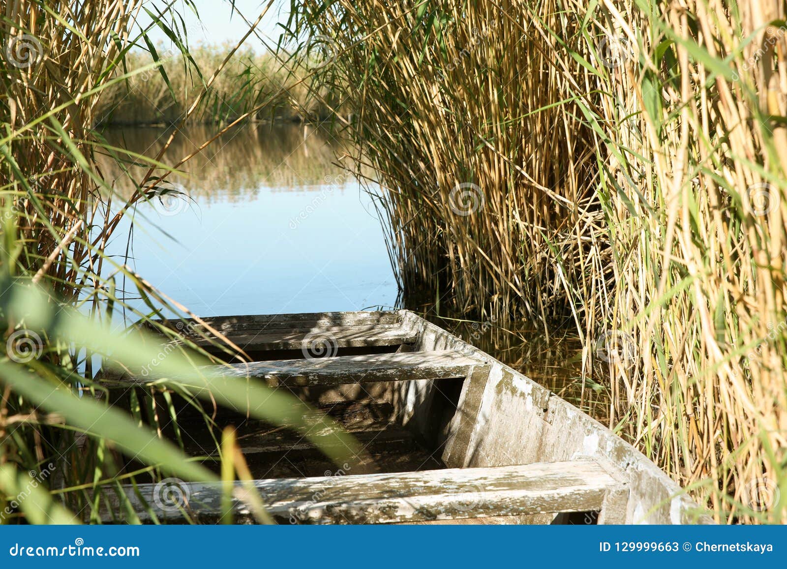 Fishing boat at riverside stock image. Image of enjoyment - 129999663