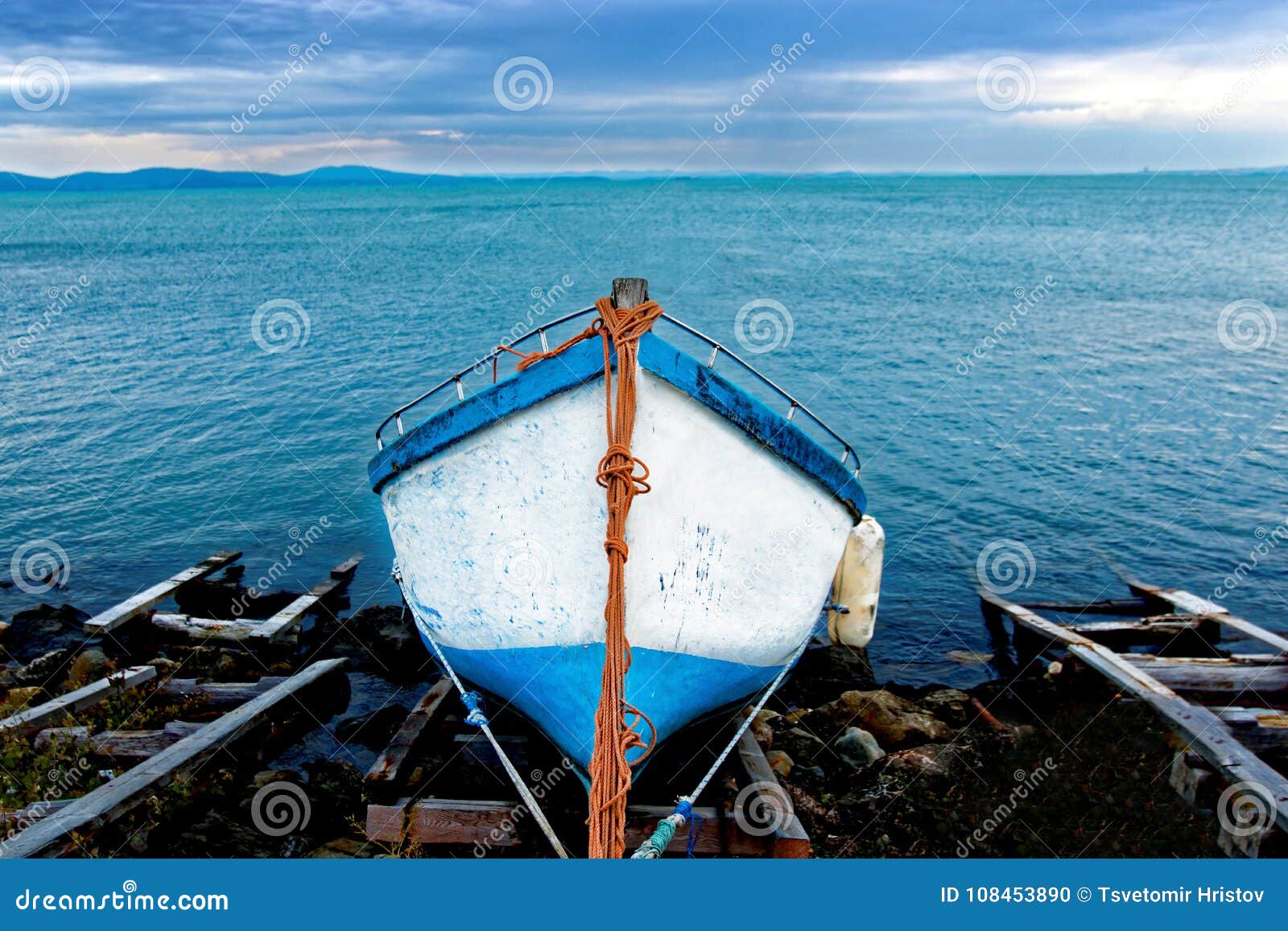 Fishing boat on the shore stock photo. Image of quay - 108453890