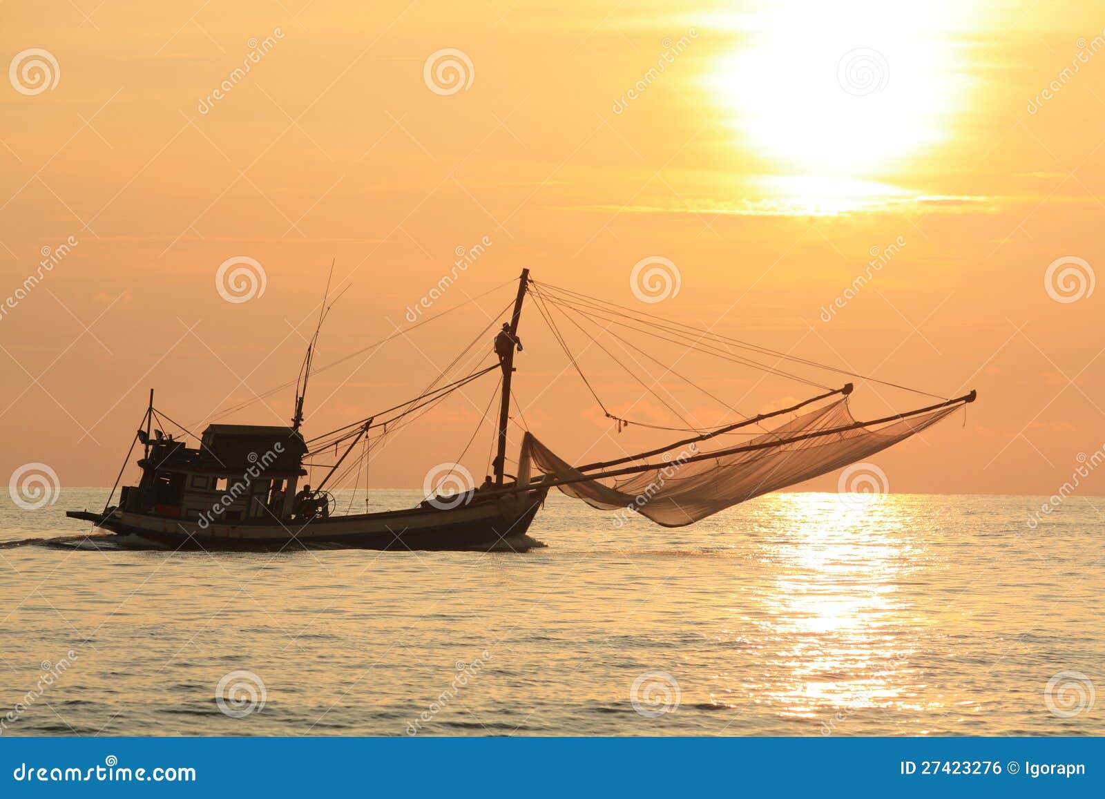 Fishing boat at sunset stock photo. Image of ocean, wind - 27423276
