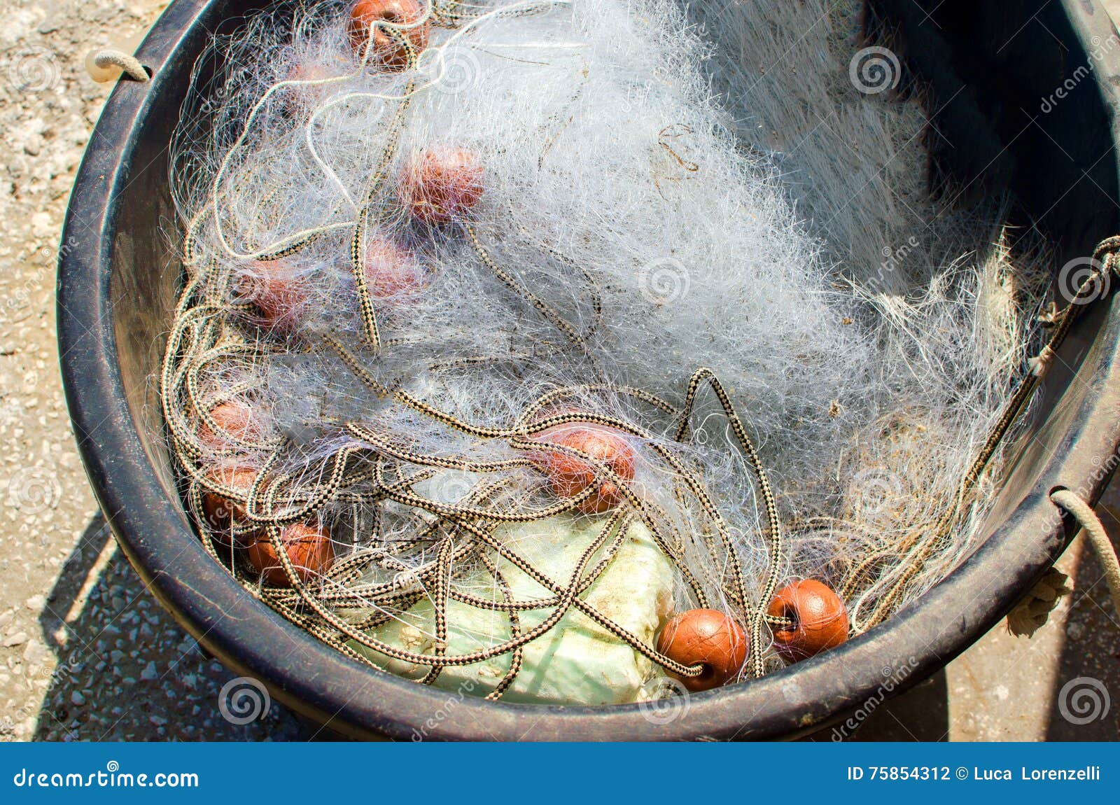 Fishing Cast Net in a Basket Dragnet Stock Photo - Image of grid ...