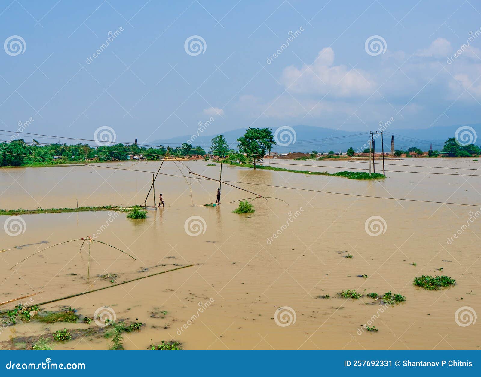 Fishing in flood waters stock image. Image of floods - 257692331
