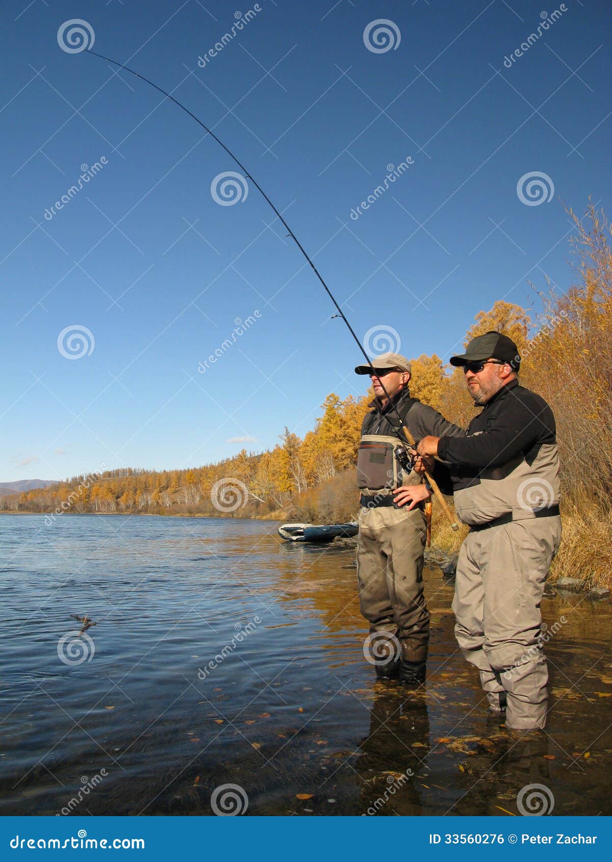 Fishing instructor stock photo. Image of angling, release - 33560276