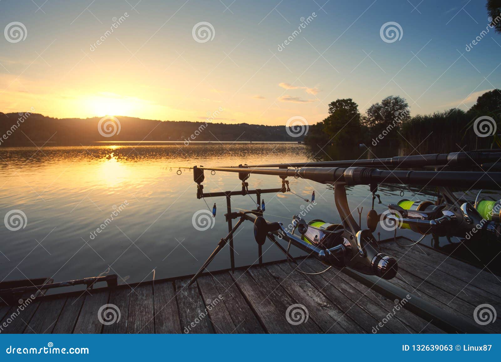 Fishing on the lake sunset stock image. Image of recreational - 132639063