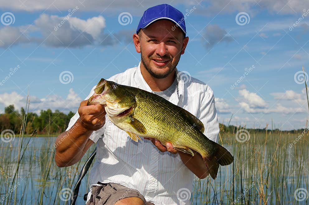 Man Fishing Large Mouth Bass Stock Photo - Image of fish, reel: 28295112