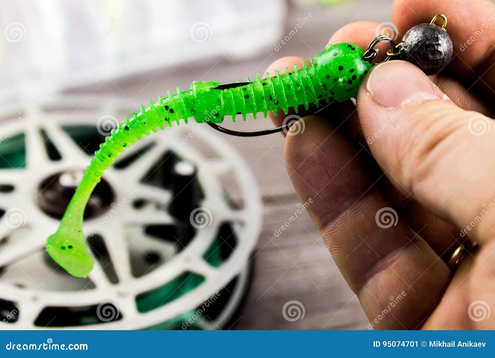 Fishing lure in the hand stock image. Image of shiny - 95074701