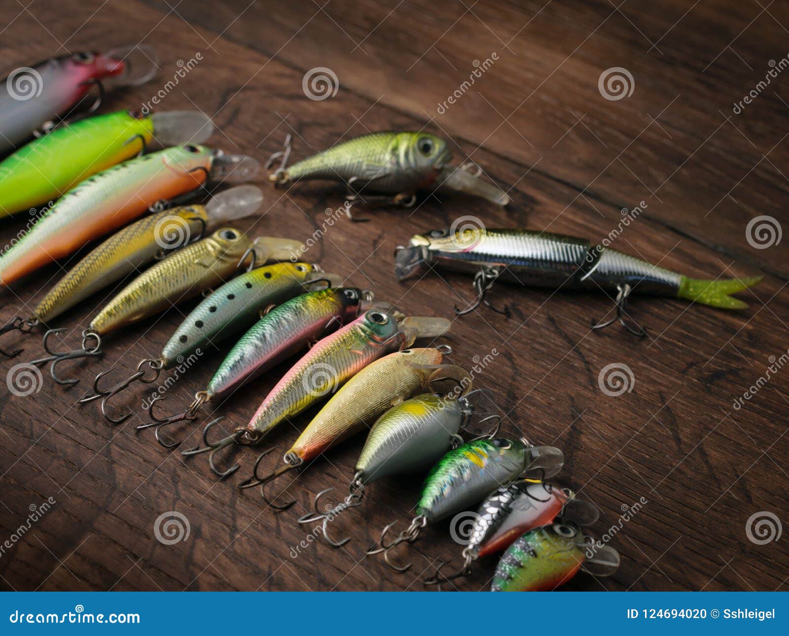 Fishing Lures of Different Sizes on a Wooden Background Stock Photo ...
