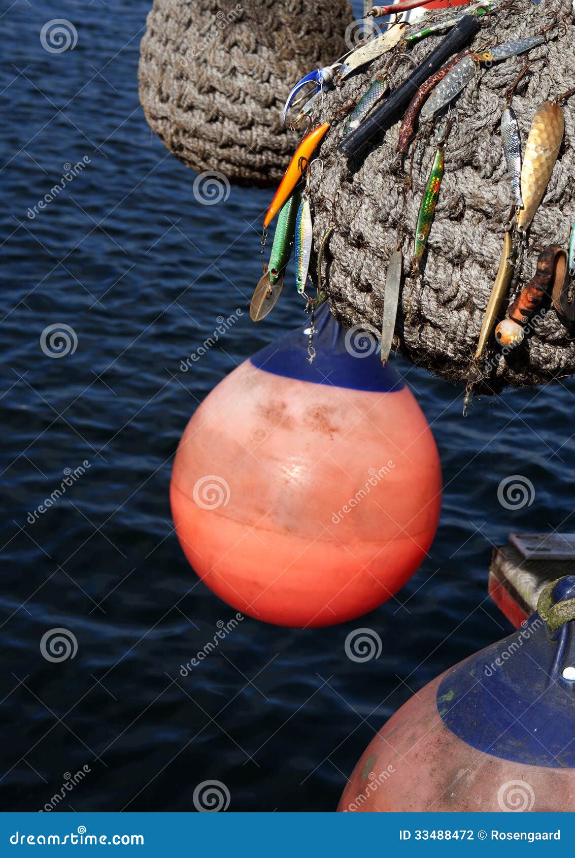Fishing Lures on Rope Fender Stock Photo - Image of bumpers, rope: 33488472