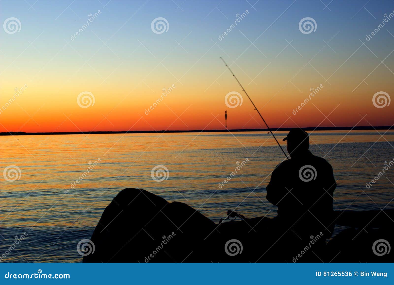 Fishing Man in the Lakeside Sunset Stock Photo - Image of rock, fishing ...