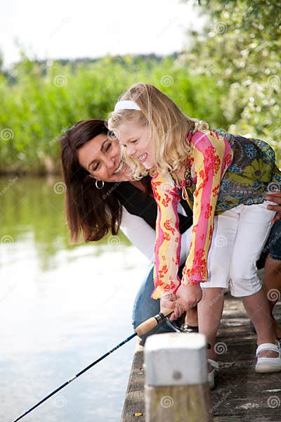 Fishing with mom stock image. Image of fishing, familylife - 9892011