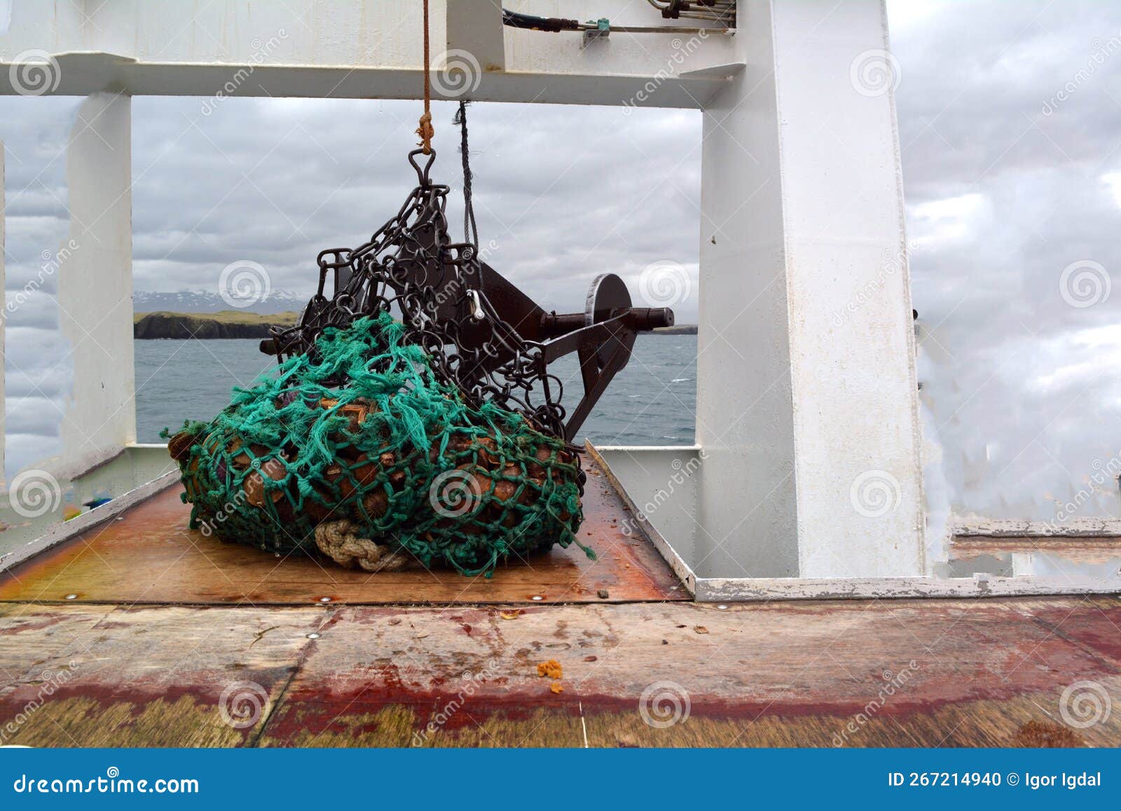 The Fishing Net with a Catch Rises To the Trawler Stock Photo - Image ...