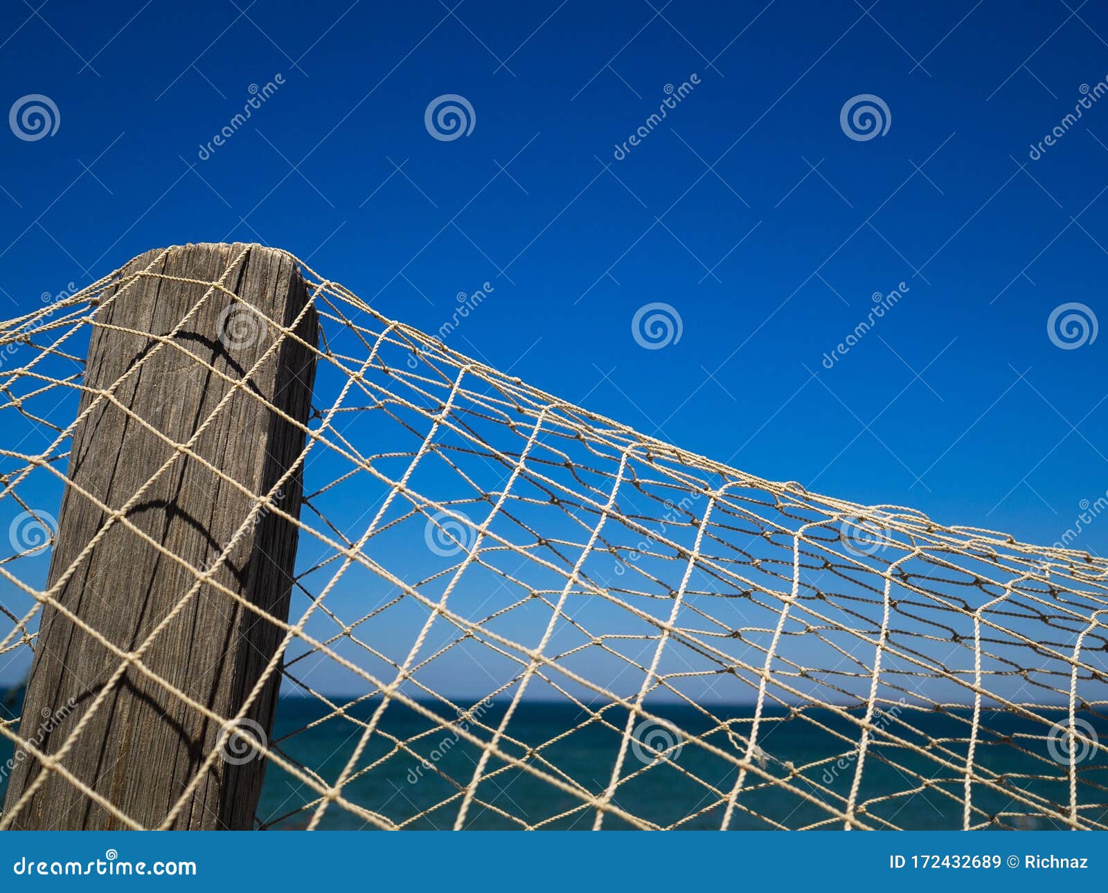 Fishing Net Hanging on the Board. Fishing Net on the Beach Stock Image ...