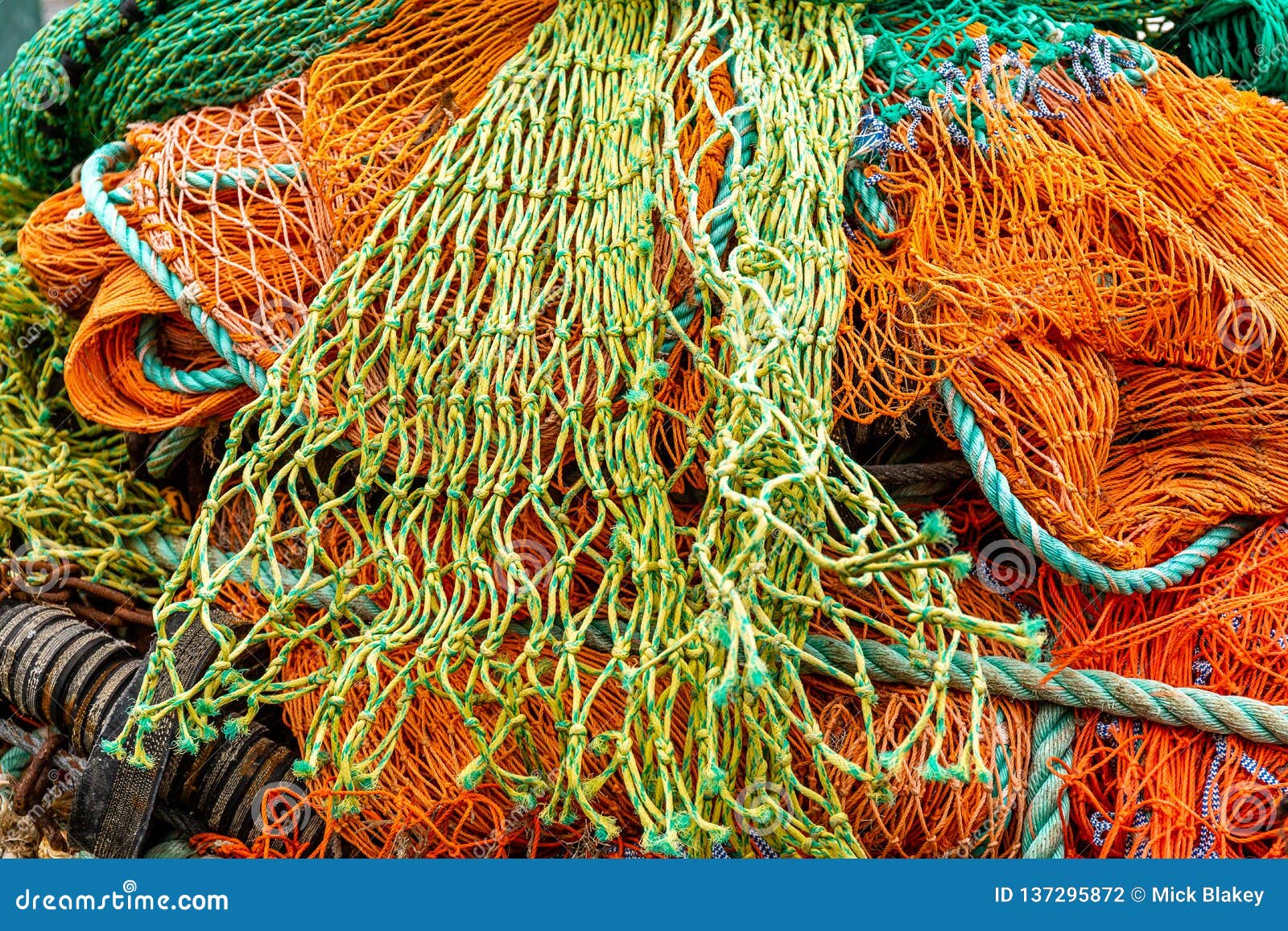 Fishing Nets and Rope in Bundle on Harbour Quay Stock Photo - Image of ...