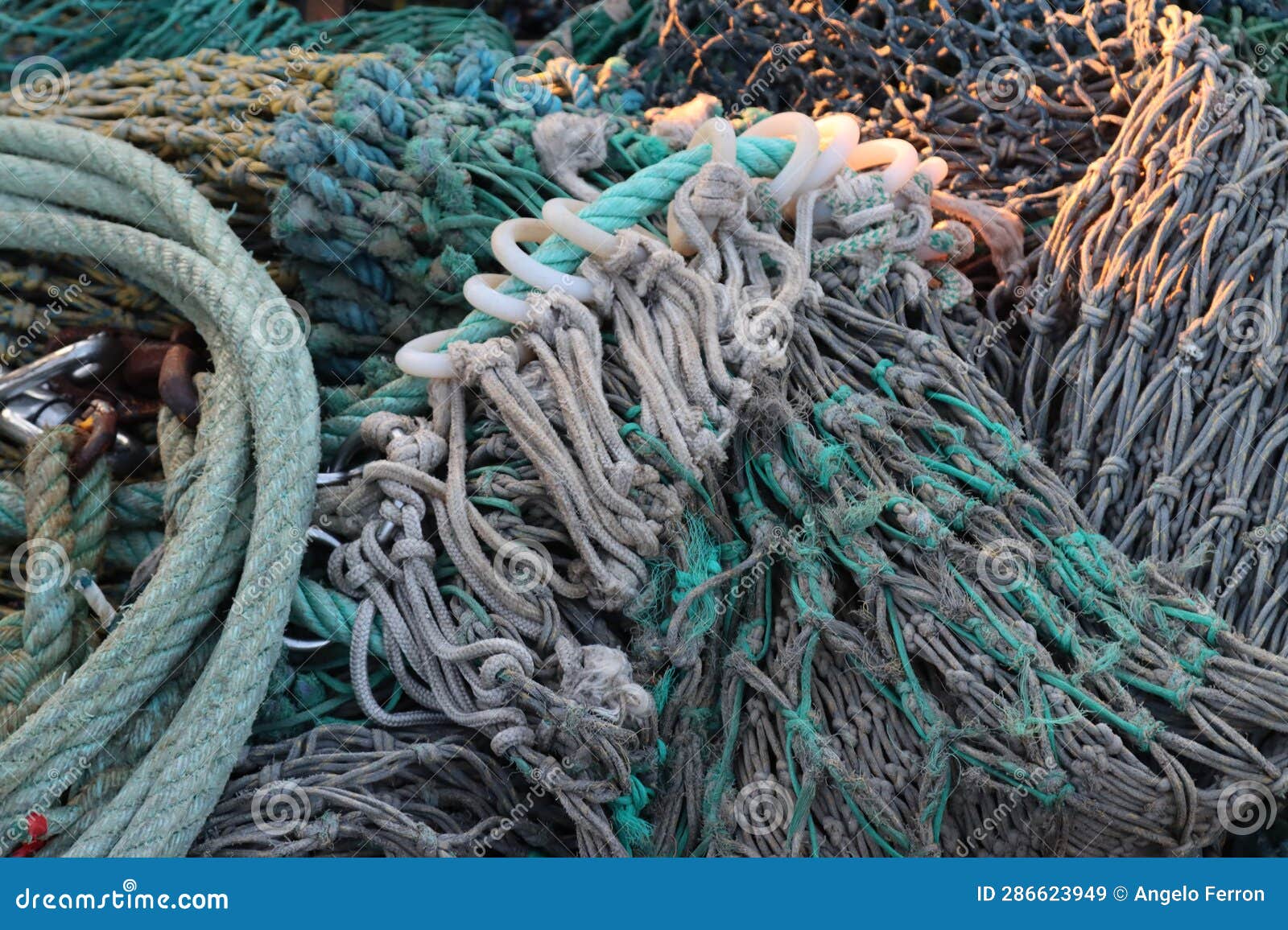 Fishing Nets Under the Coast Piled Ashore- Stock Image - Image of sand ...