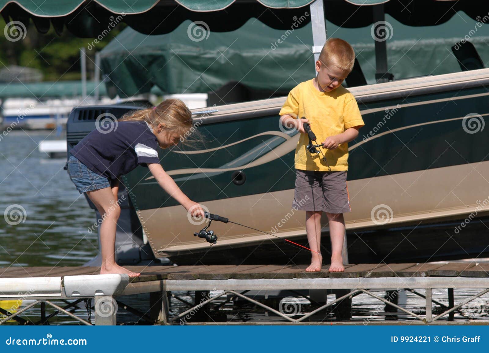 Fishing Off a Dock stock image. Image of active, boat - 9924221