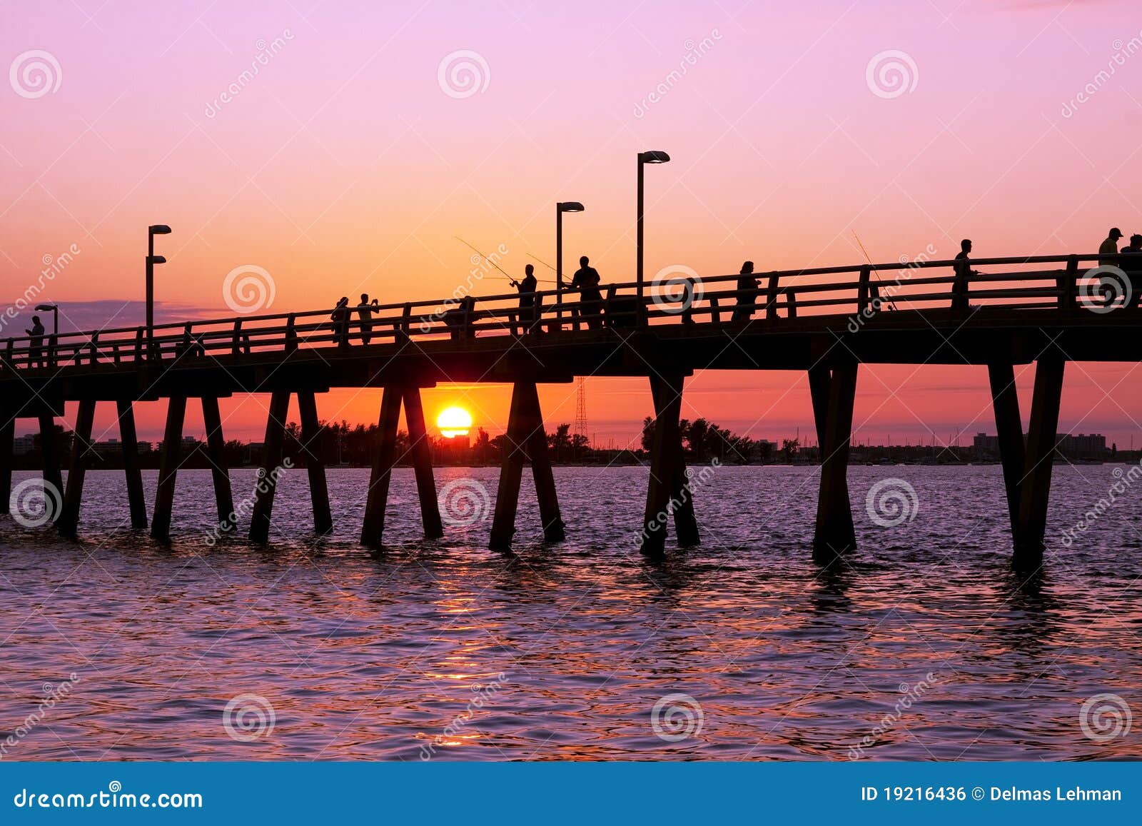 Fishing Off the Pier at Sunset Stock Photo - Image of fishermen, action ...