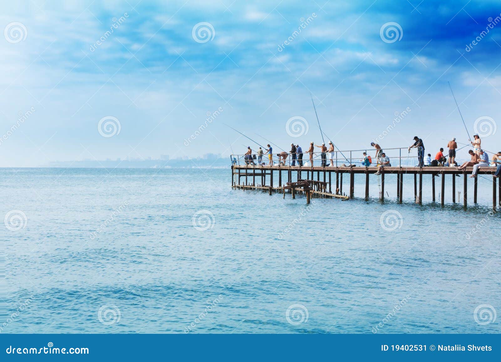 Fishing on a pier stock image. Image of blue, summer - 19402531