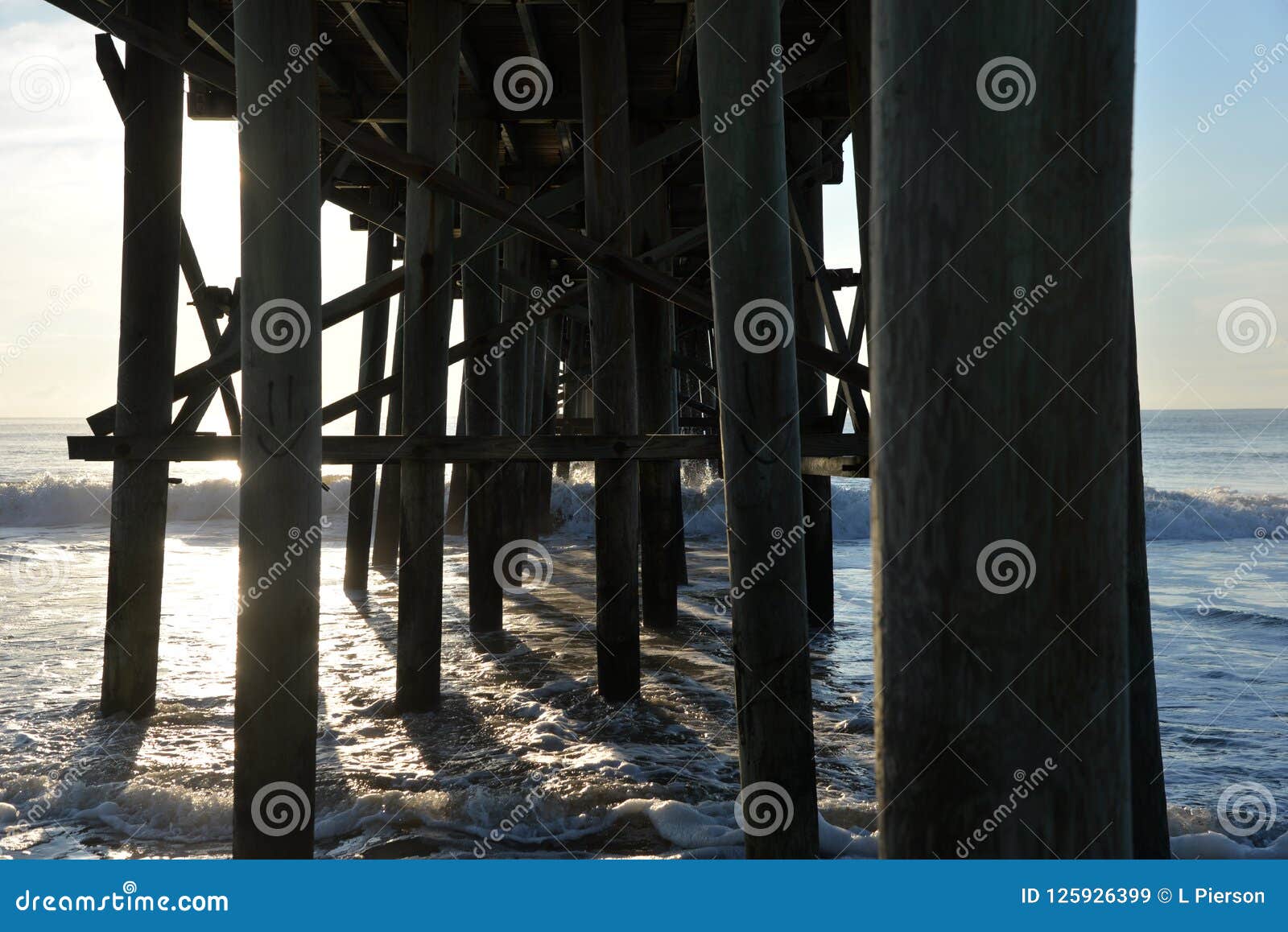 The Fishing Pier is Built with a Solid Array of Large Wood Planks Stock ...