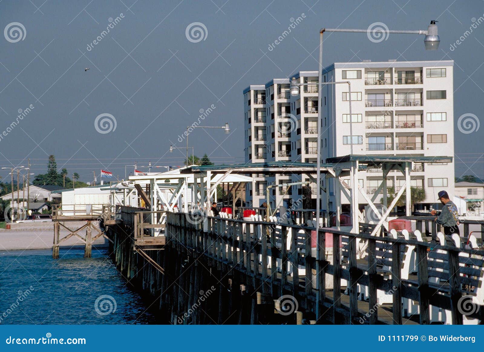 Fishing Pier with Hotels in Background Stock Image - Image of structure ...