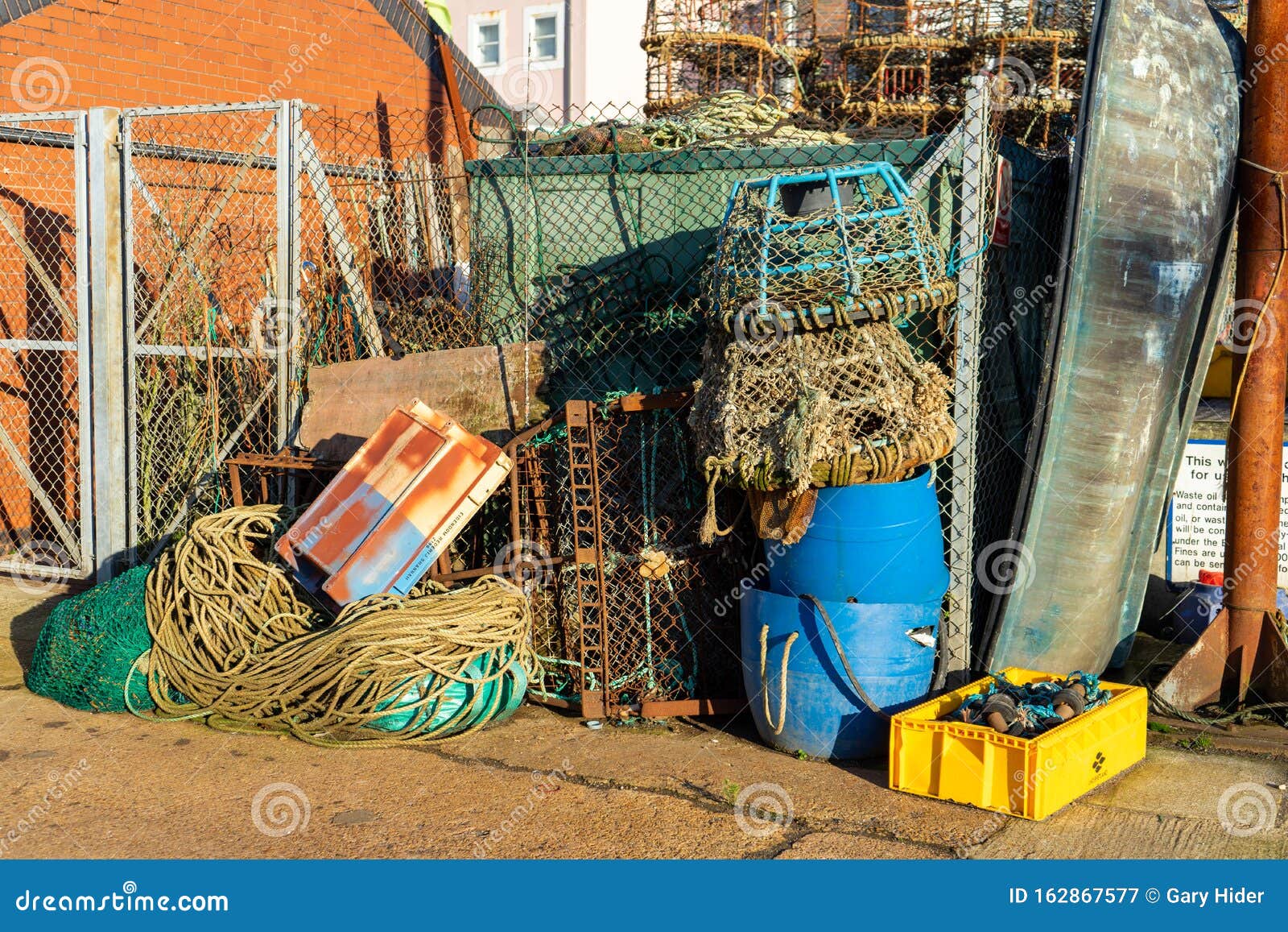 Fishing Pots and and Fishing Nets on a Quayside or Dock Stock Image ...