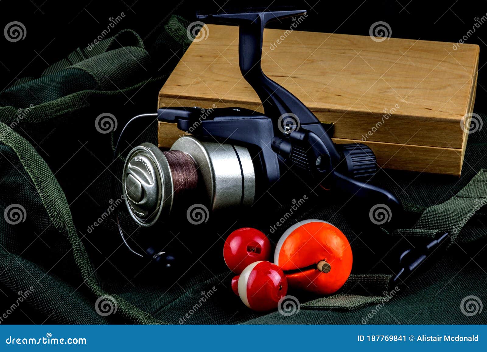 Fishing Reel with Floats and Tackle Box on Fishing Bag Stock Image ...
