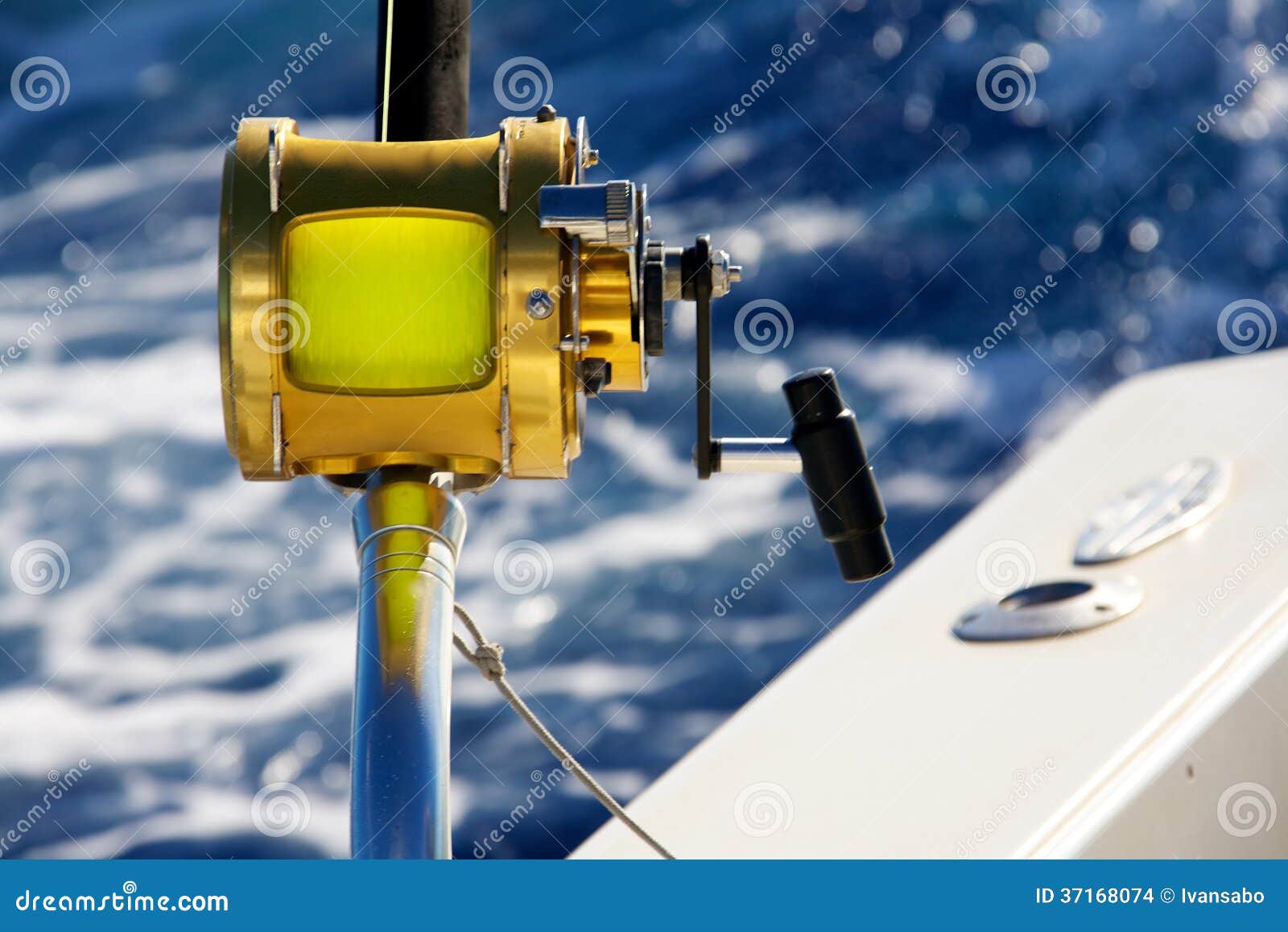 A Fishing Reel Set Against Blue Ocean Stock Photo - Image of coast ...