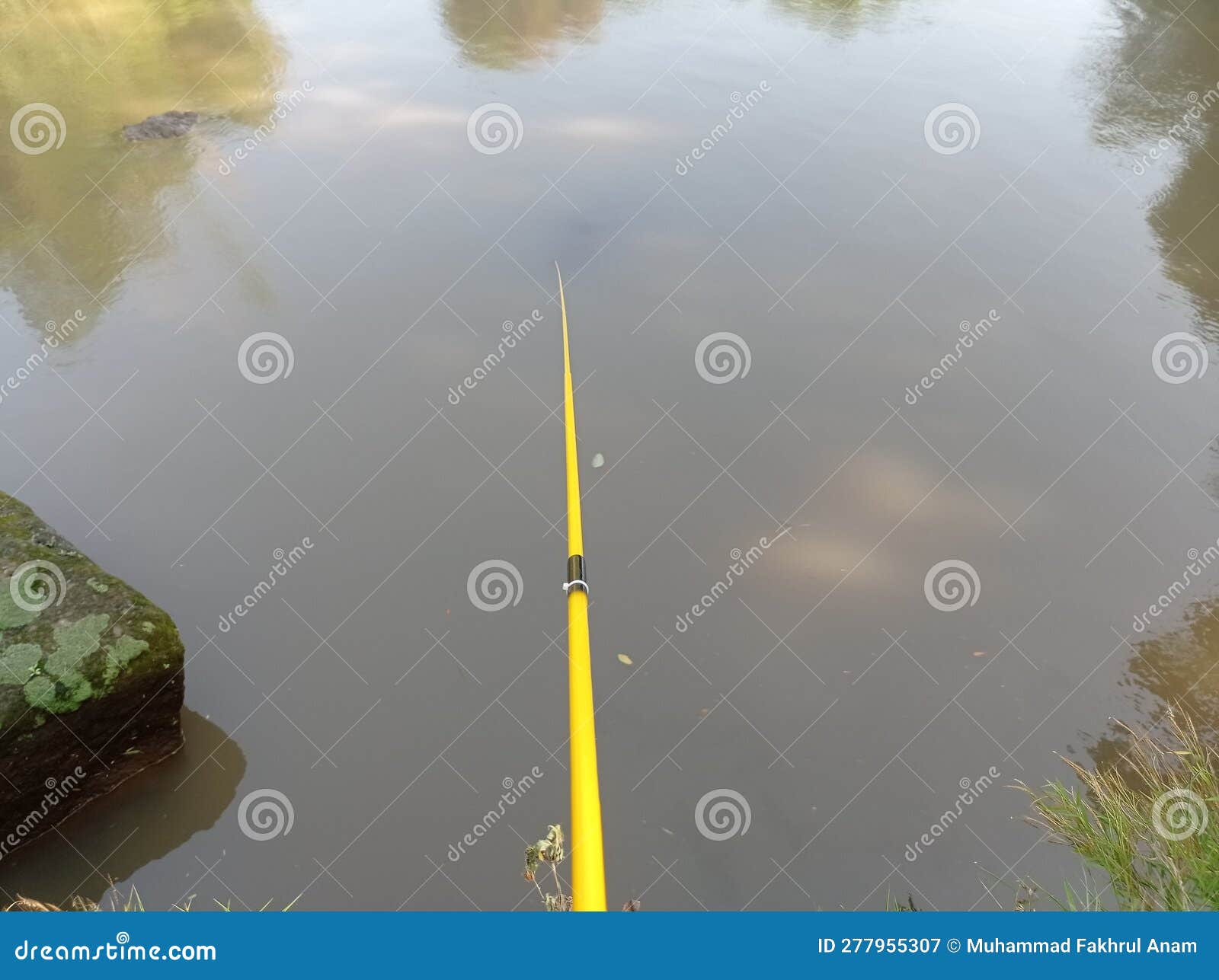 Fishing in the River with a Yellow Rod Stock Image - Image of hobbies ...