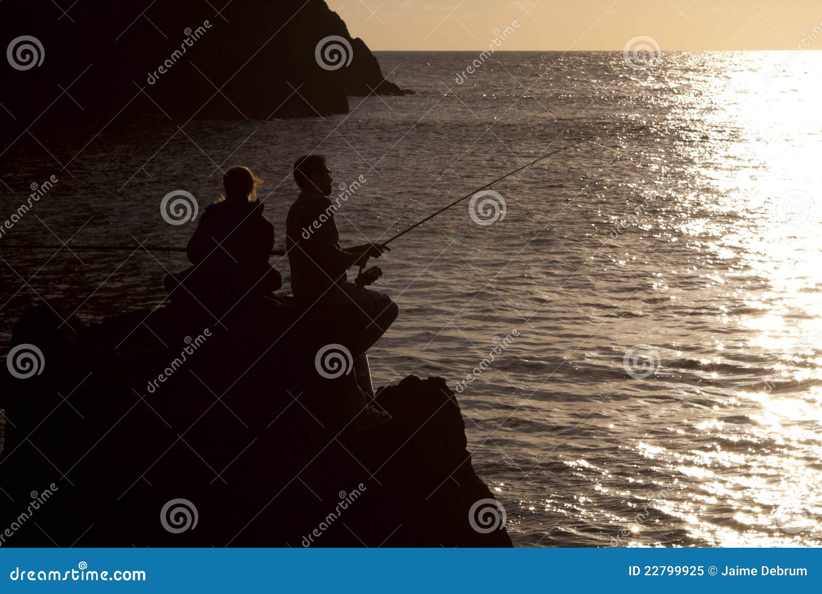 Fishing on the rocks stock image. Image of fisherman - 22799925