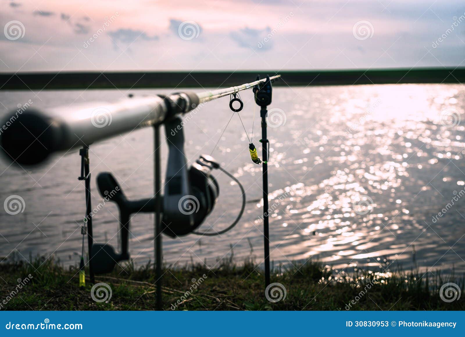 Fishing Rod with Focus on the Wire Stock Image - Image of reel, sunset ...