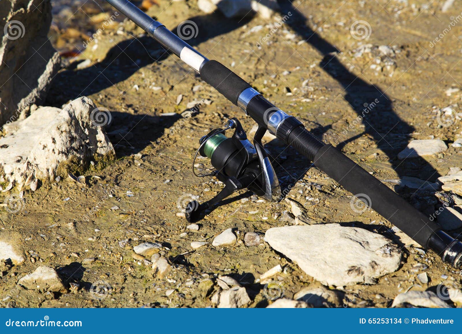 Fishing rod on the ground stock photo. Image of recreation - 65253134