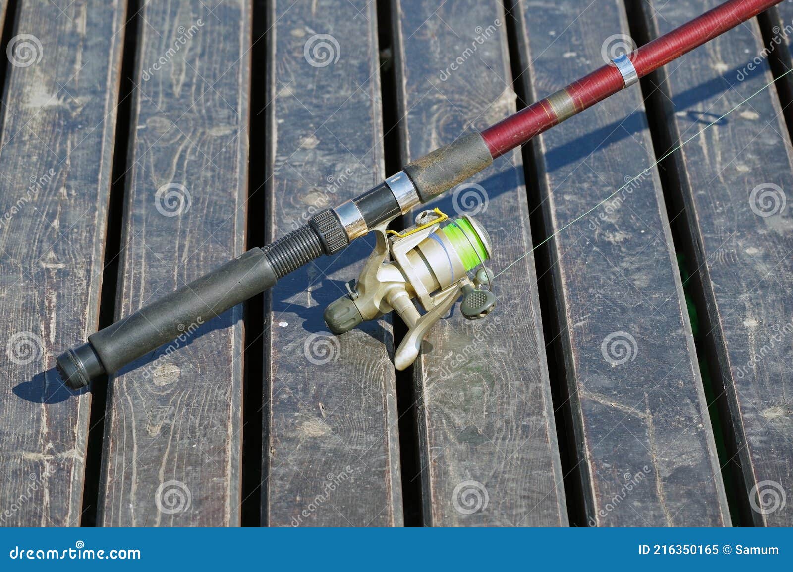 Fishing rod on the pier stock image. Image of tackle - 216350165