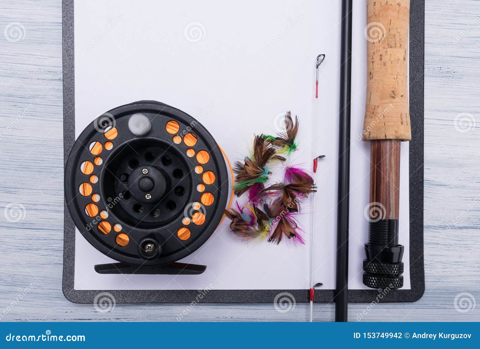 Fishing Rod with Reel are on a Tablet with Clean Paper Stock Photo ...