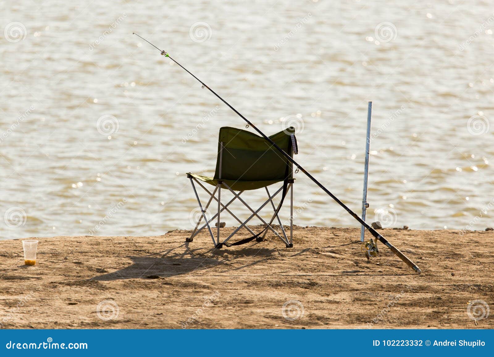 Fishing Rod on the River Bank Stock Photo - Image of line, water: 102223332