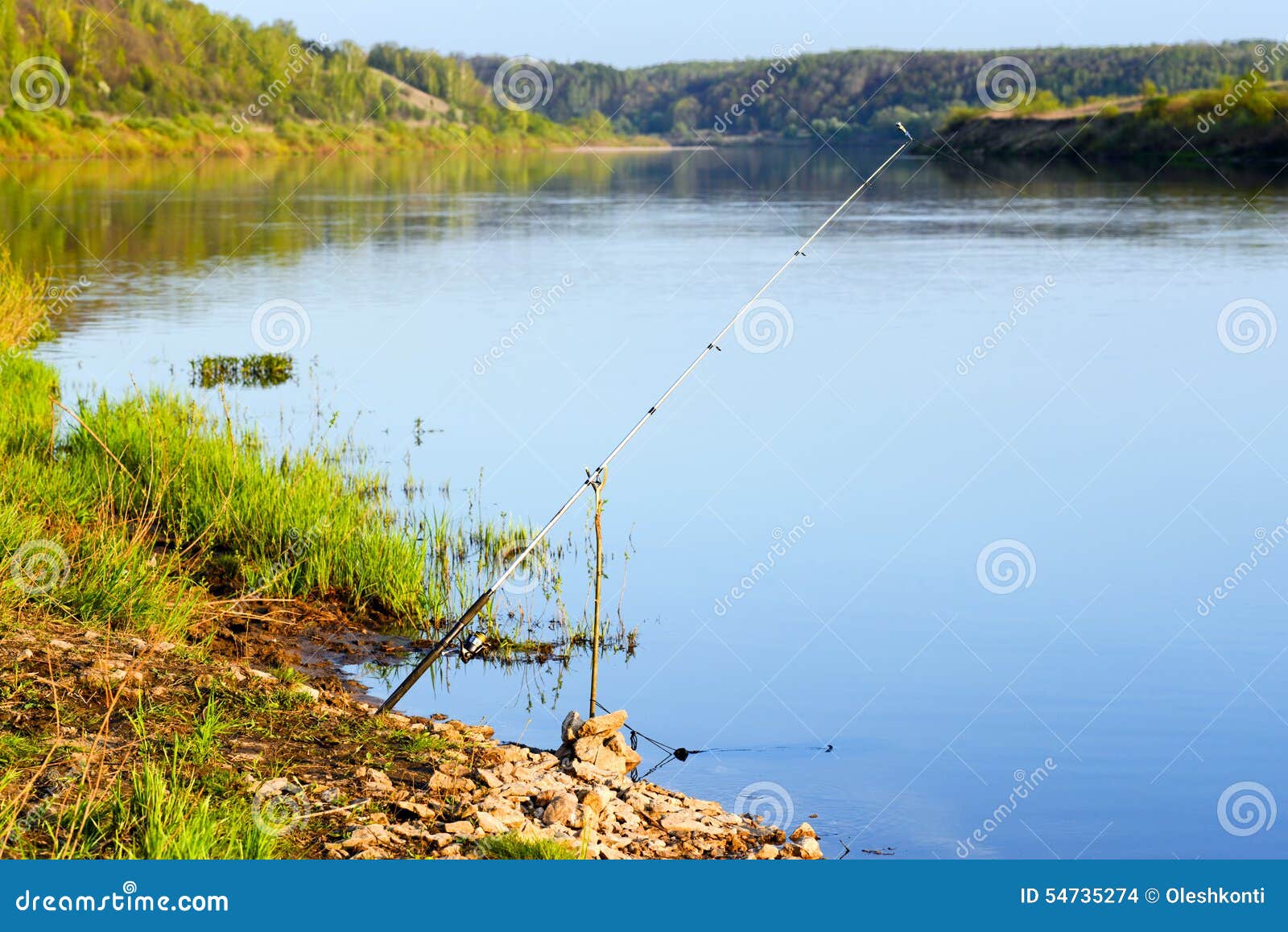 Fishing rod on the river stock photo. Image of pursuit - 54735274